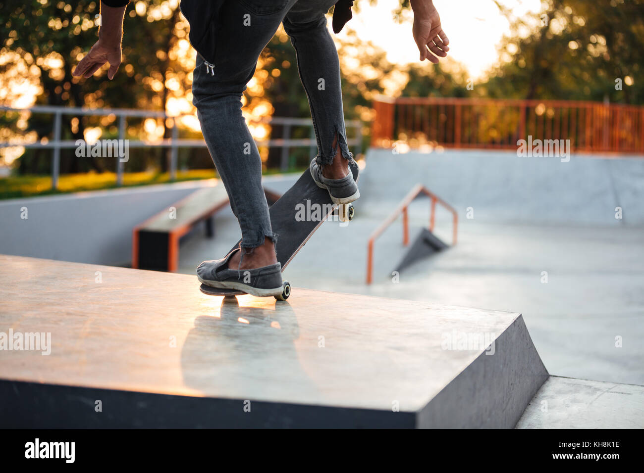 Close up of a young skateboarder in action on a ramp Stock Photo - Alamy