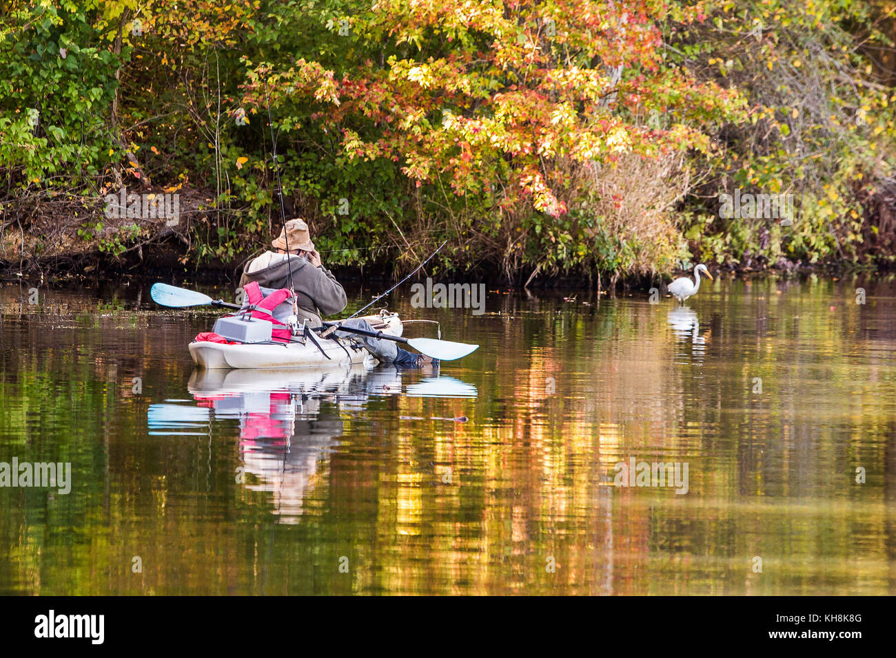 Fishing at the lake in autumn Stock Photo - Alamy