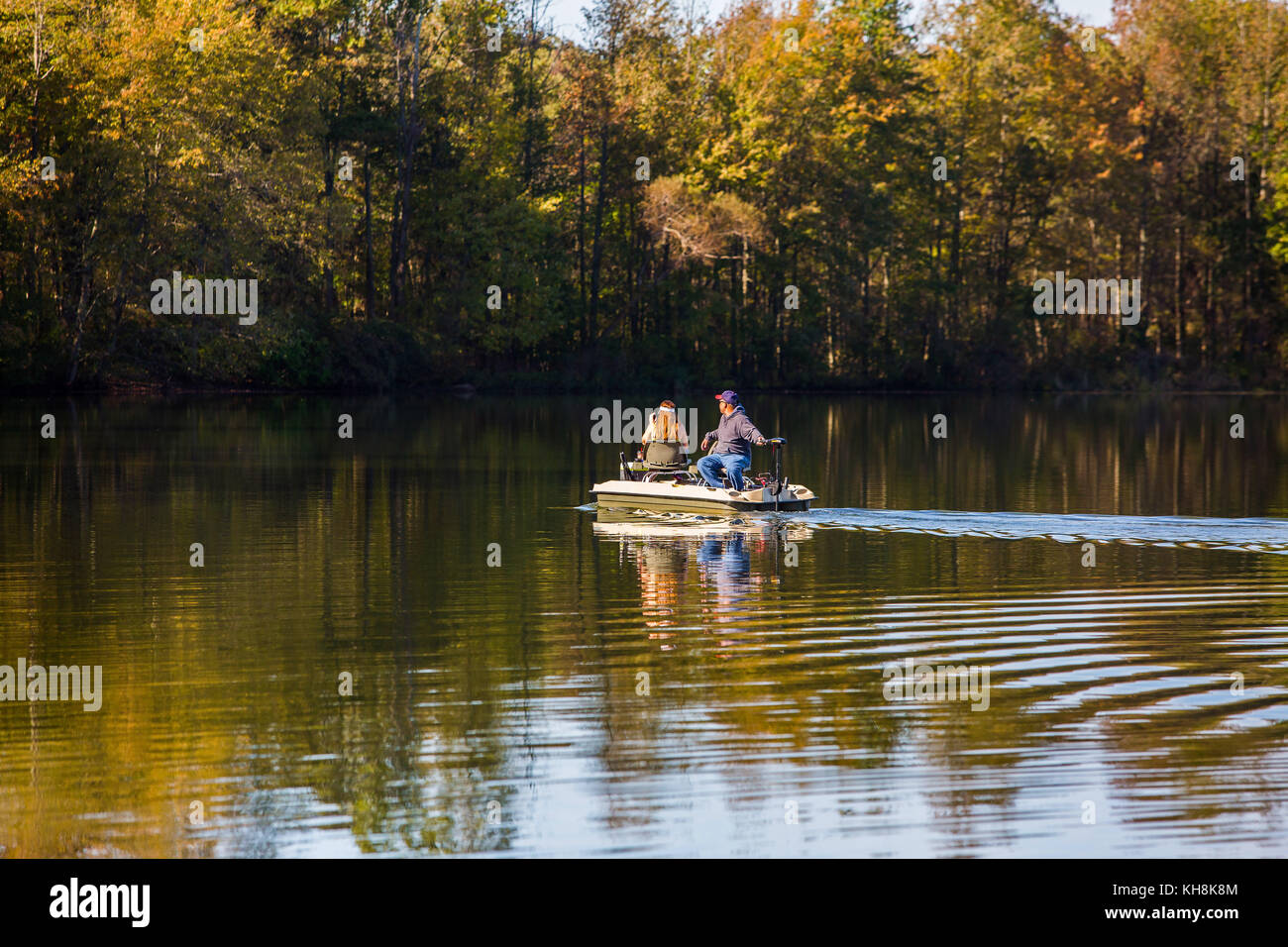 Fishing at the lake in autumn Stock Photo - Alamy