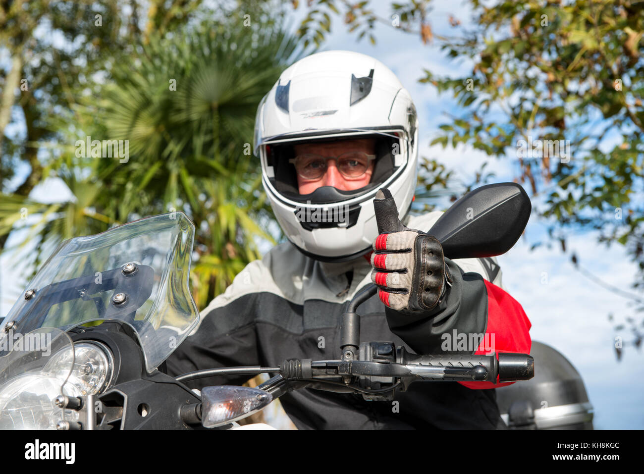 a portrait of a senior biker on his motorcycle Stock Photo - Alamy