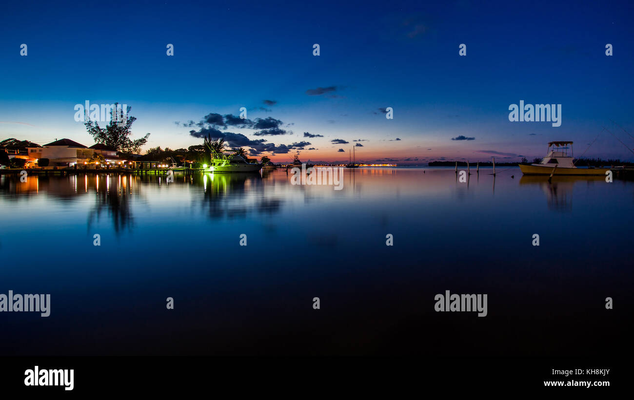 Boats in the bay at night Stock Photo - Alamy