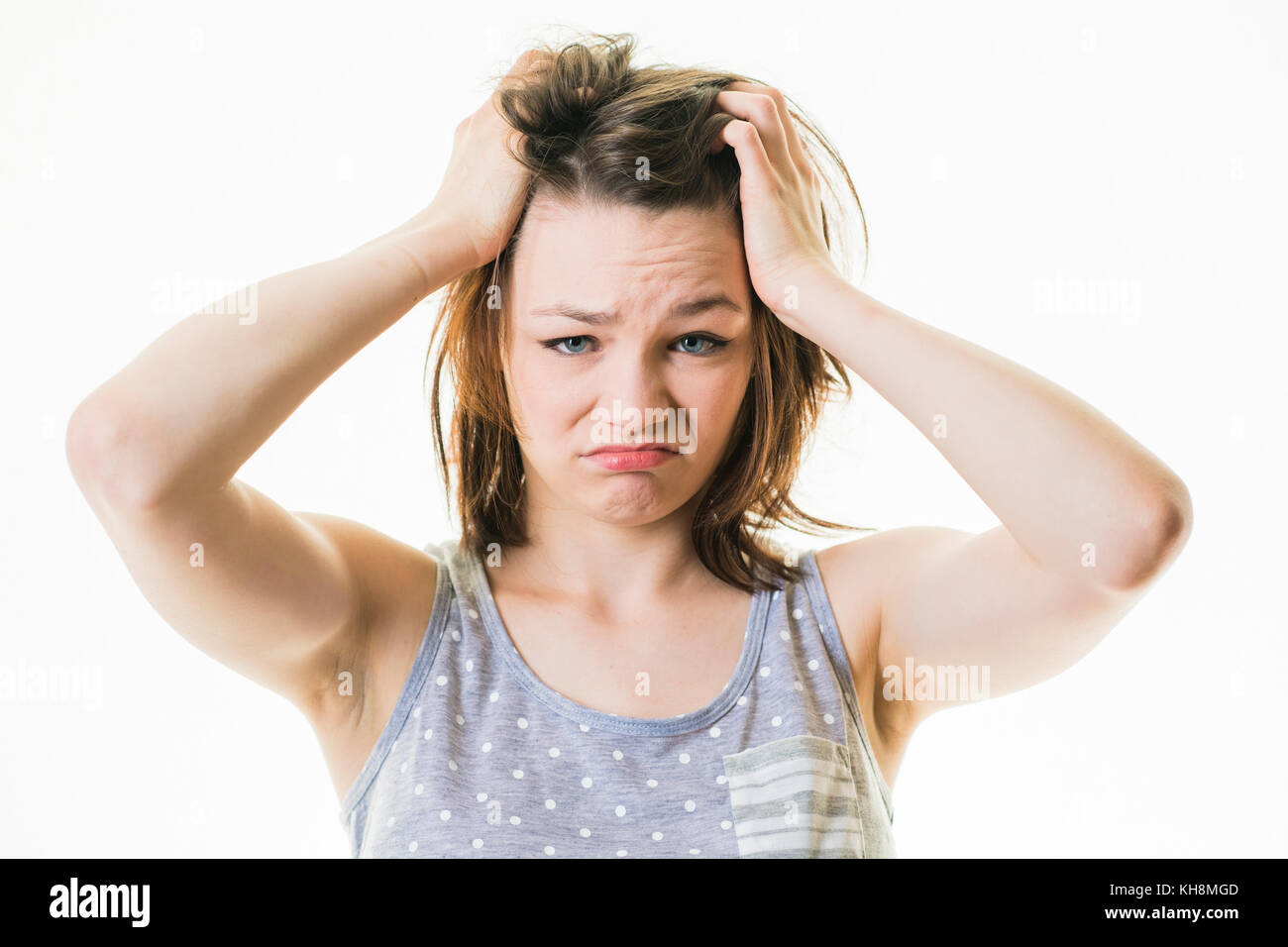 A young brown haired caucasian teenage girl wearing pyjams looking ...