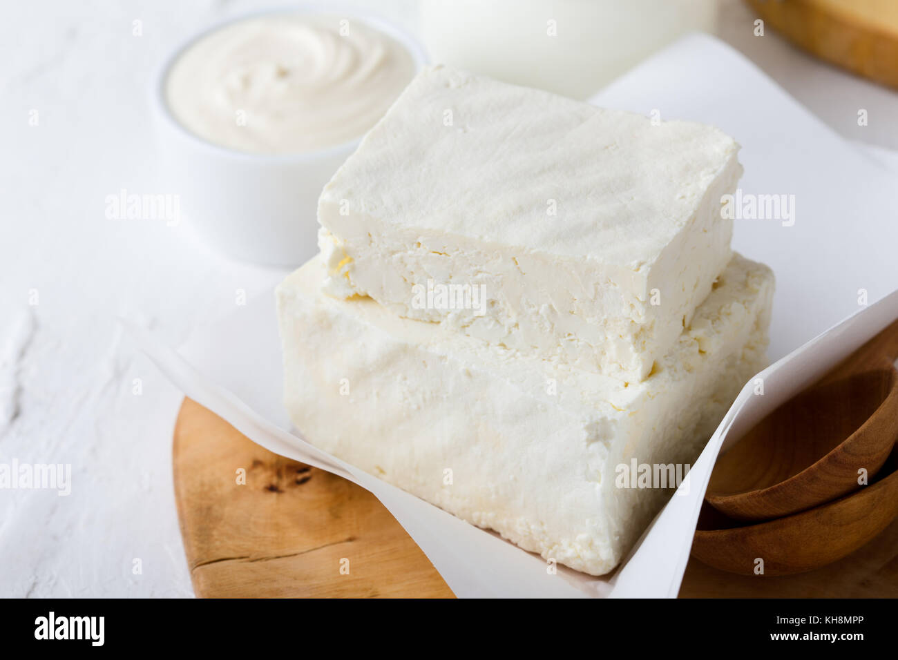 Curd cheese. Fresh organic dairy products on white table Stock Photo ...