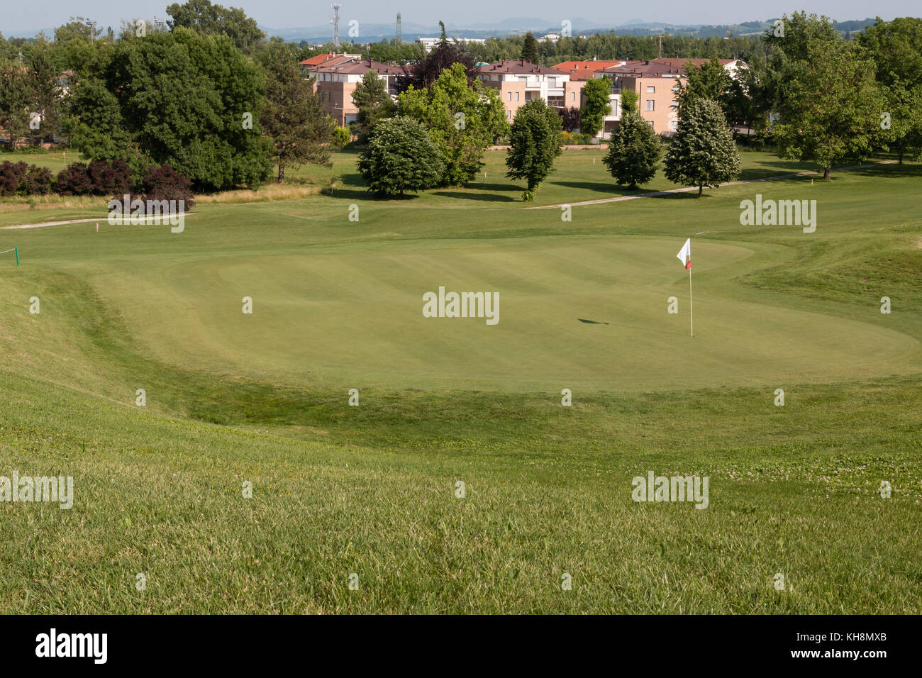 White Flagstick in Green Golf Course in Sunny Day Stock Photo - Alamy