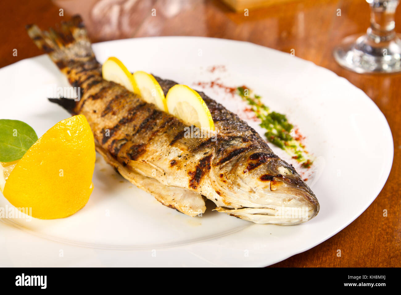 Grilled fish with lemonand chilli dressing Stock Photo - Alamy