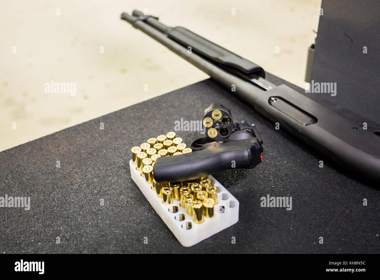 Shotgun and revolver with ammo Stock Photo - Alamy