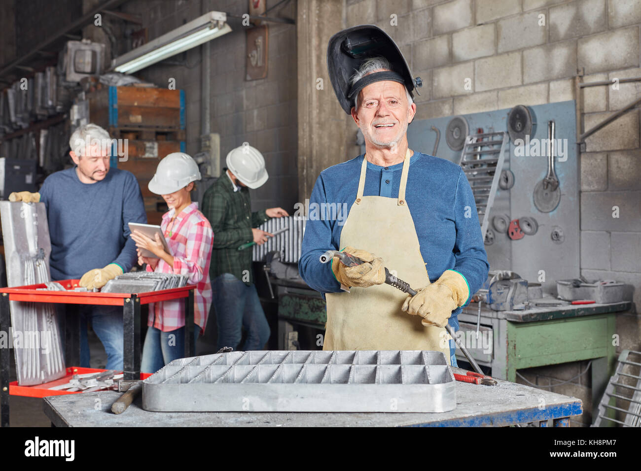 Senior as welder with experience in metallurgy workshop Stock Photo - Alamy