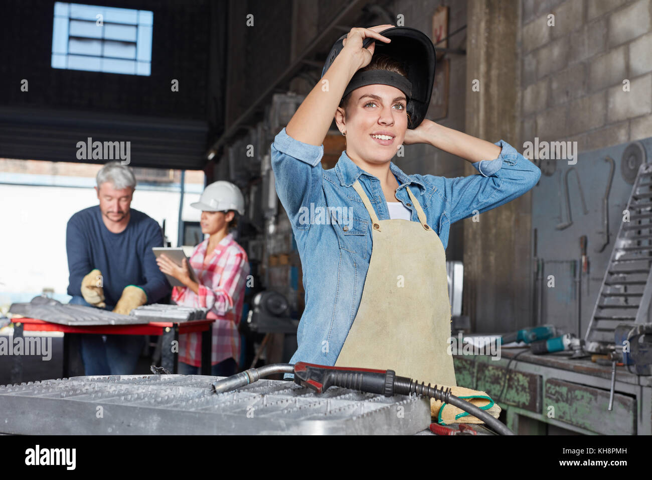 Young woman as apprentice worker in metallurgy apprenticeship Stock ...