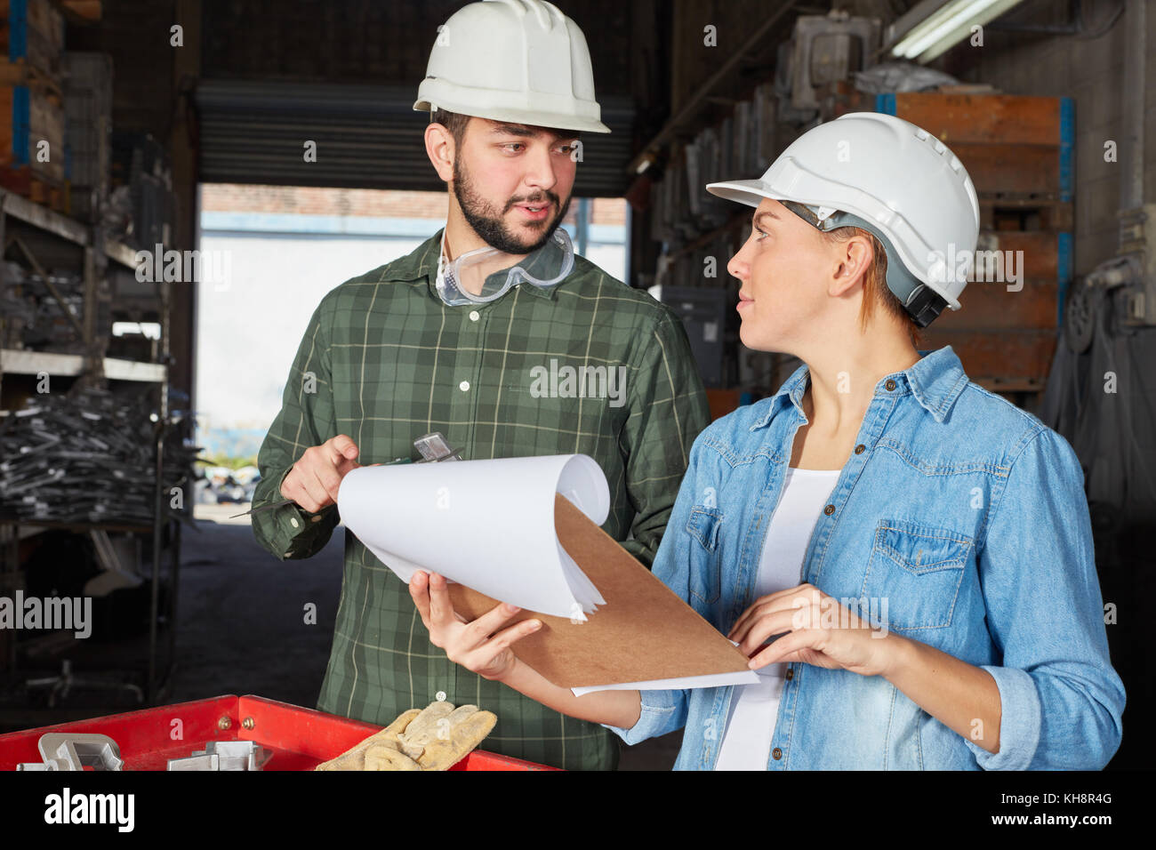 Worker and colleague working and controlling with checklist Stock Photo ...