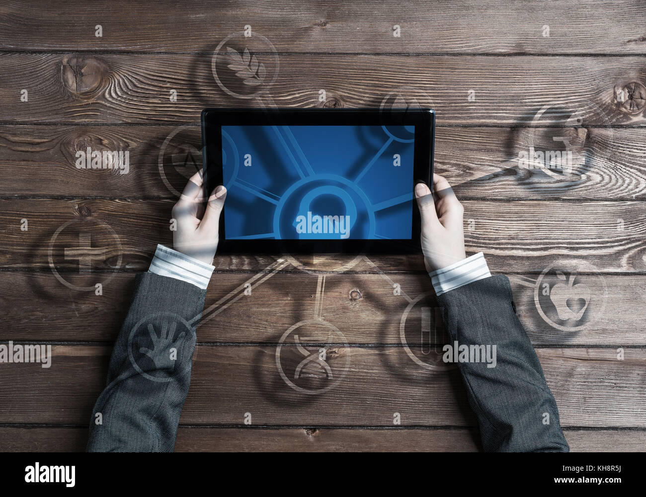 Business workplace with tablet device in female hands and media user ...