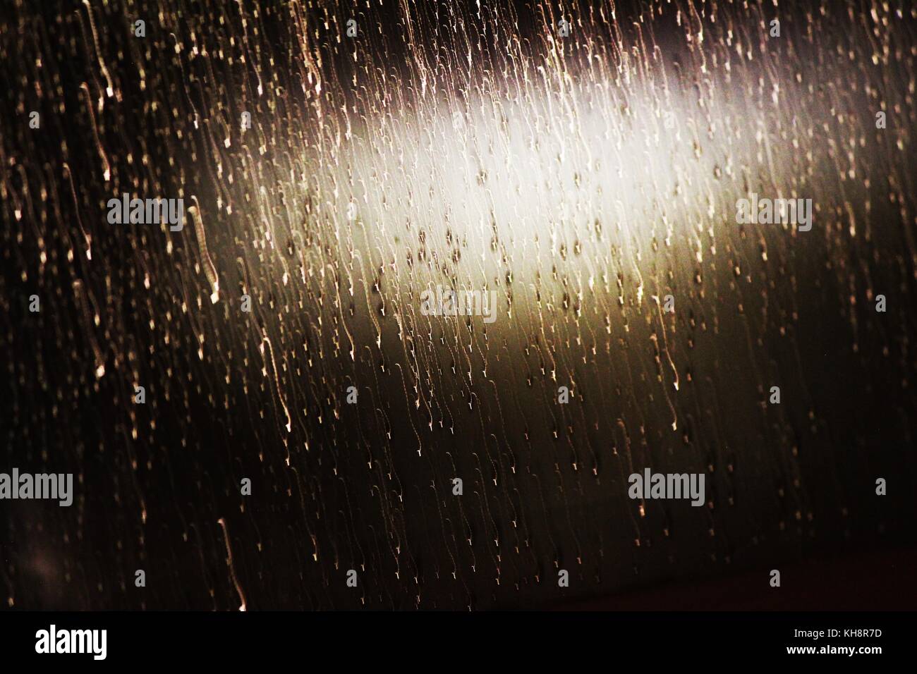 Drop of rain in dark night at window sign different things Stock Photo ...