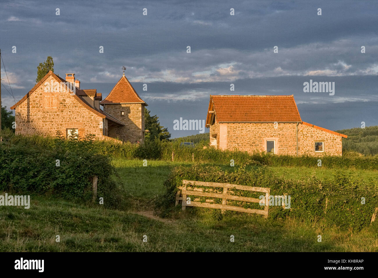 Buildings of a French farm in the sunset Stock Photo - Alamy