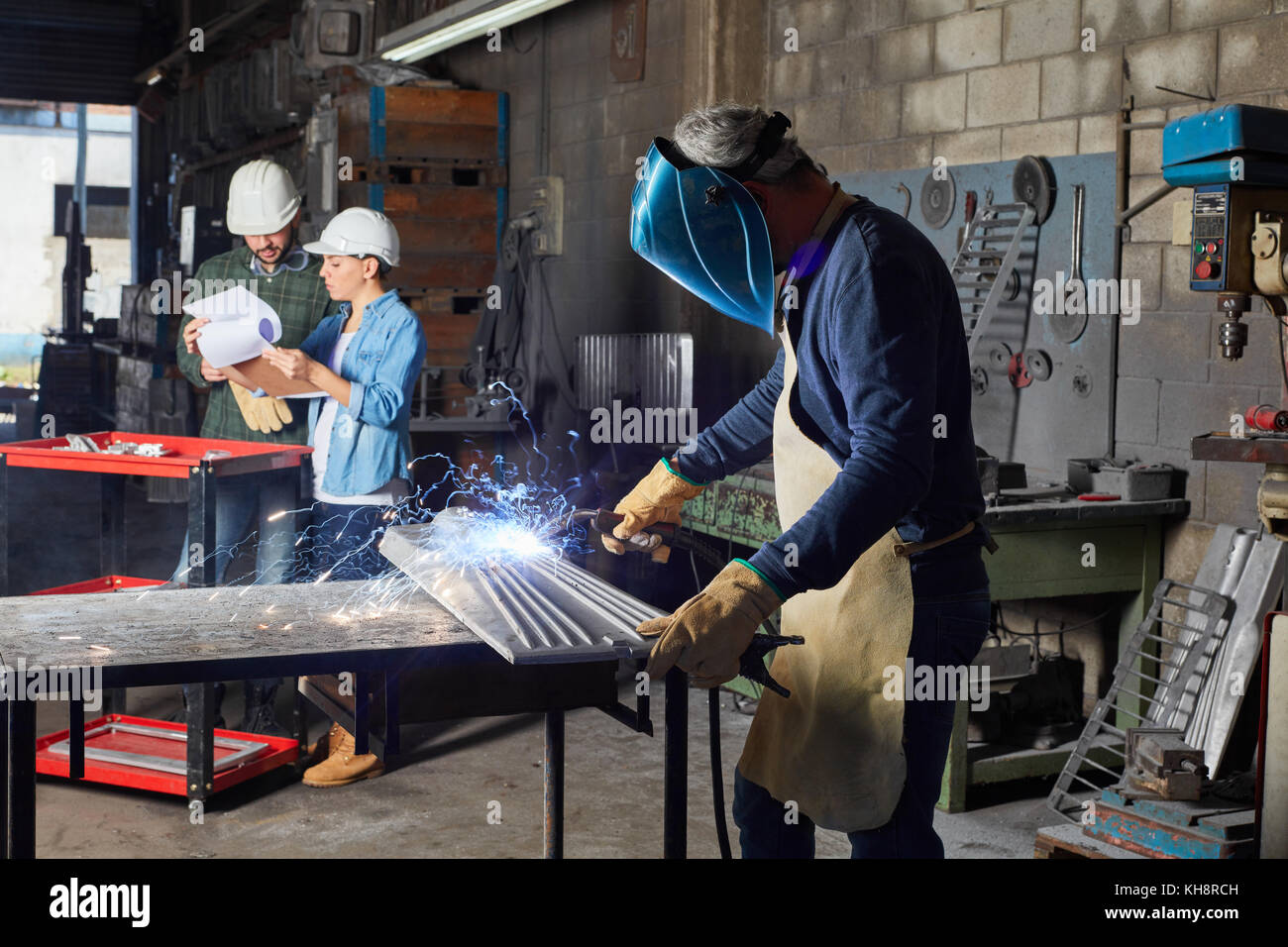 Welding workshop with man working with metal with a spark Stock Photo ...