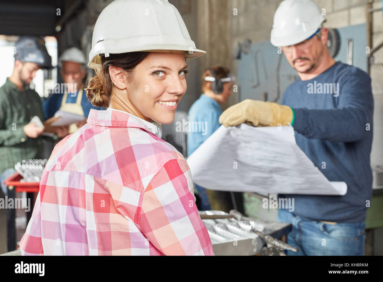 Young woman as worker apprentice in metal construcion Stock Photo - Alamy