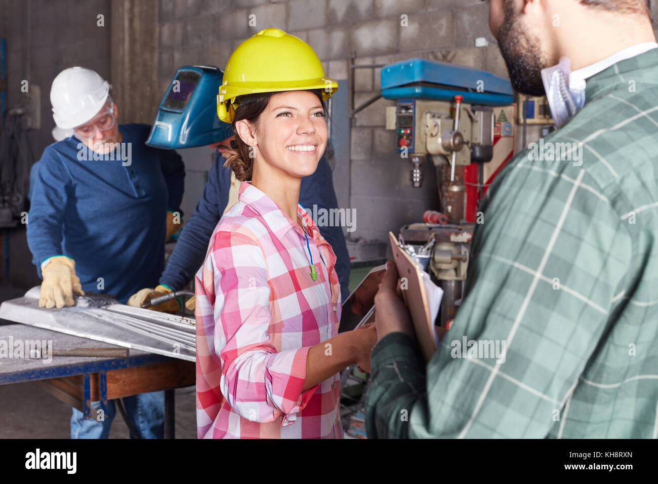 Woman as craftsman apprentice with artisan as instructor Stock Photo ...
