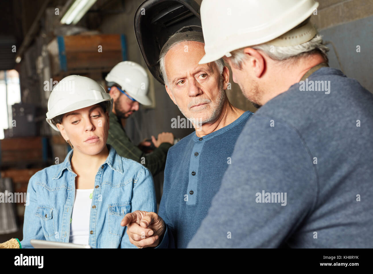 Factory workers in a meeting planning in teamwork Stock Photo - Alamy