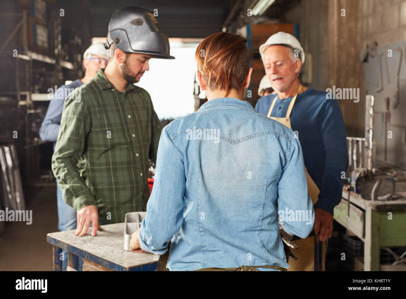 Metal construction workers work together in metallurgy workshop Stock ...