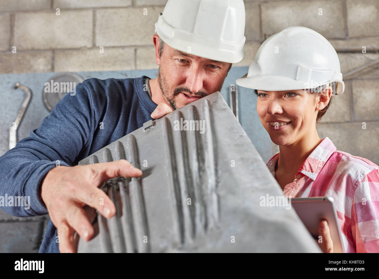 Metalworkers make quality control in metallurgy workshop Stock Photo ...