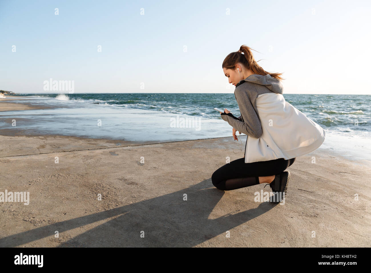 Woman Sitting Back View Knee High Resolution Stock Photography and ...