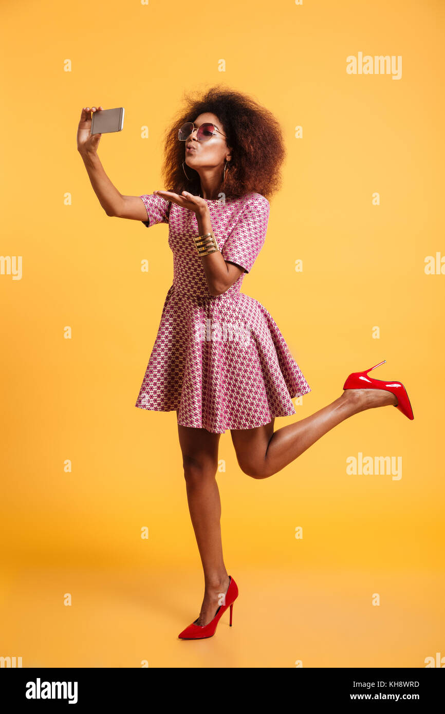 Full length portrait of a lovely afro american woman in retro style ...