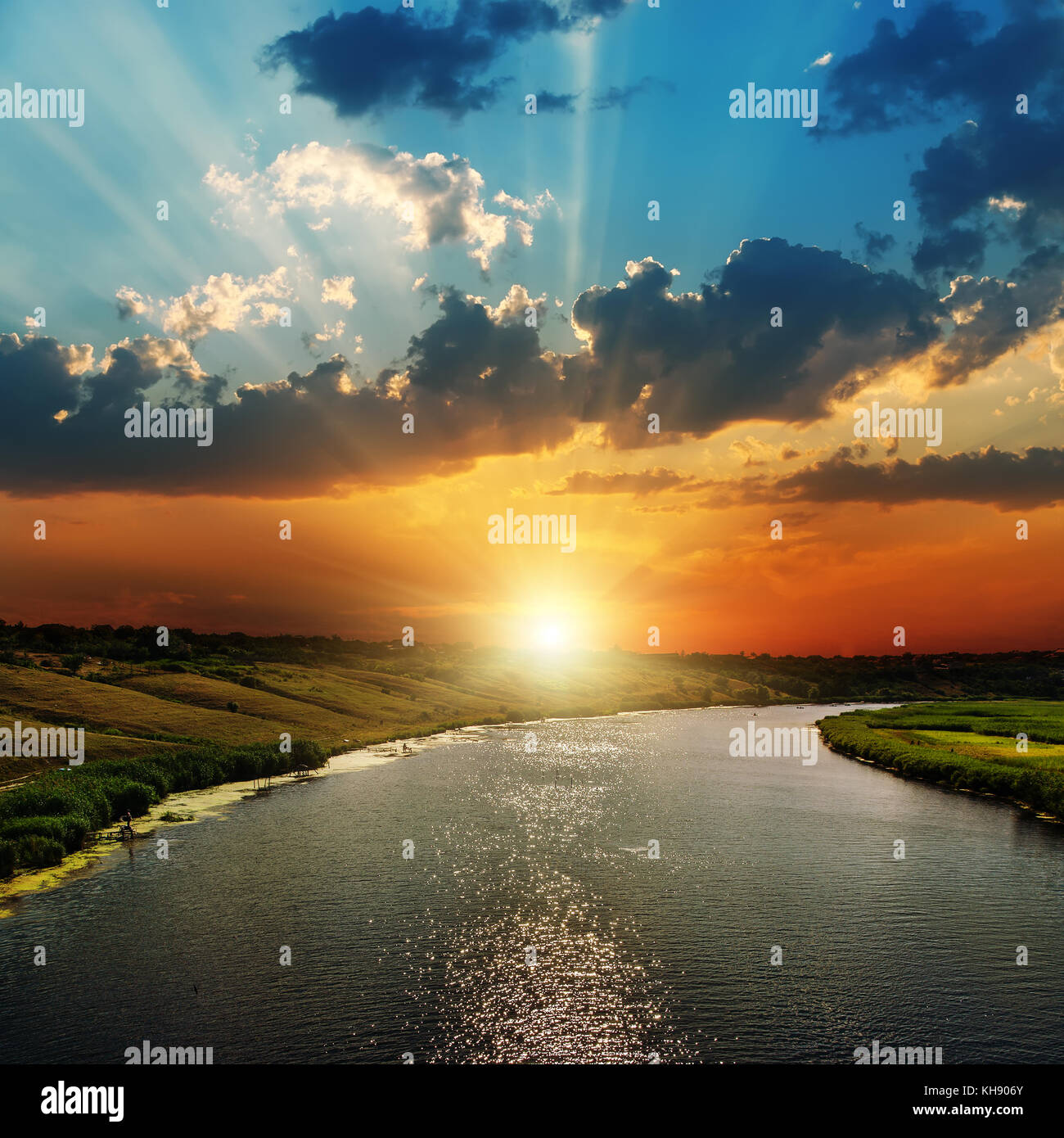 sunset over river Stock Photo - Alamy