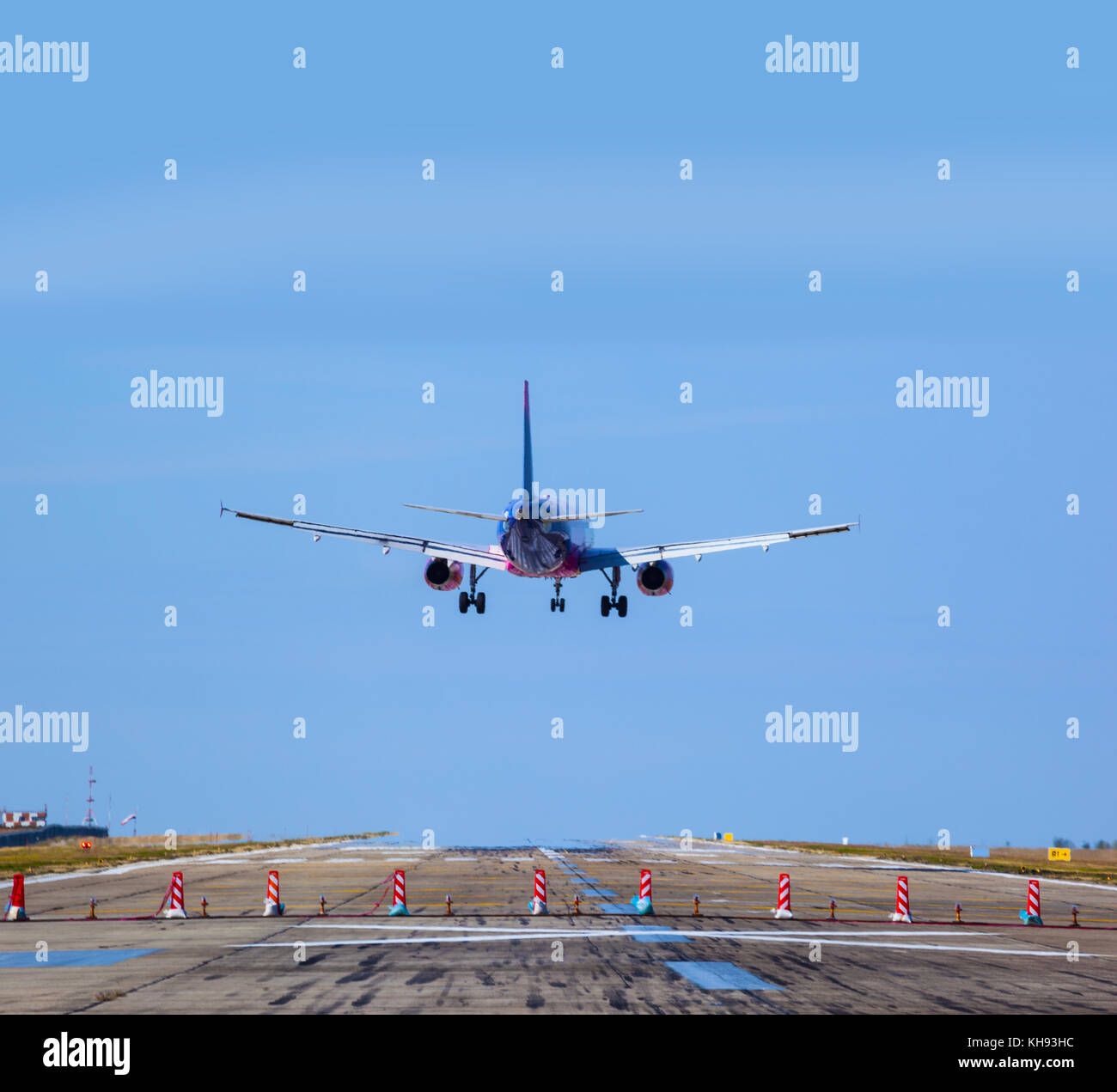 Airplane landing to runway Stock Photo - Alamy