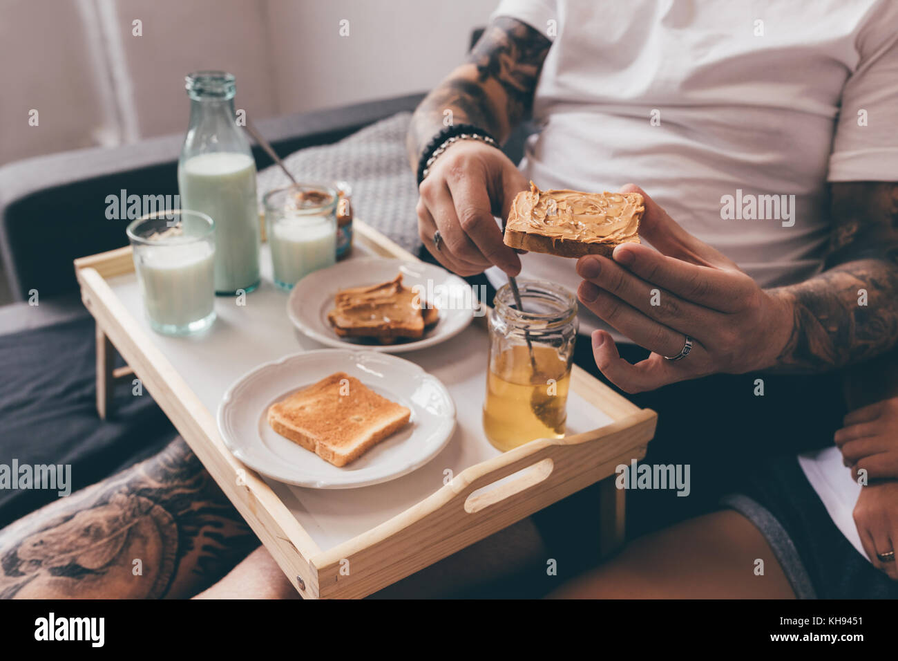man holding toast with peanut butter Stock Photo - Alamy