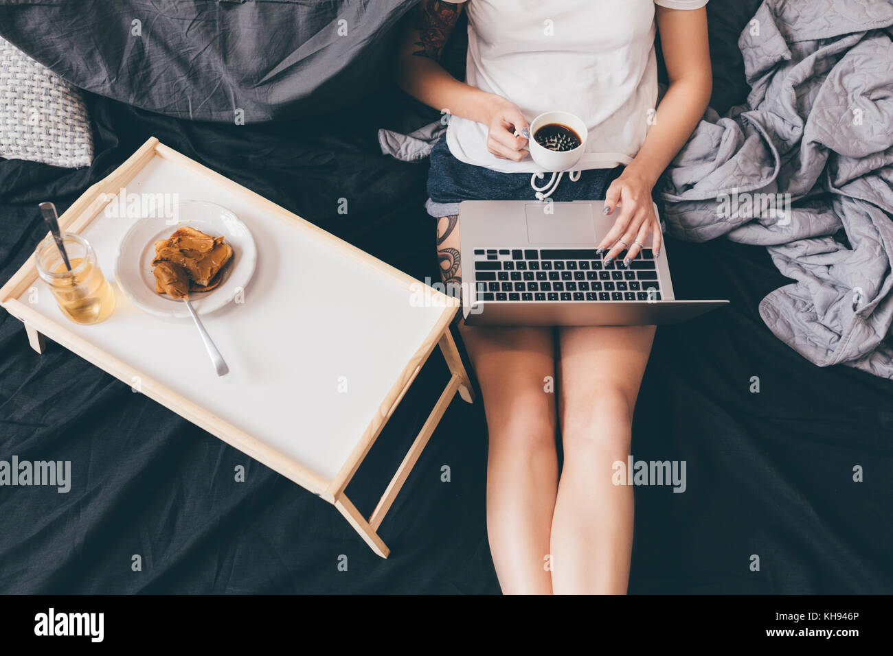 woman with laptop on bed Stock Photo - Alamy