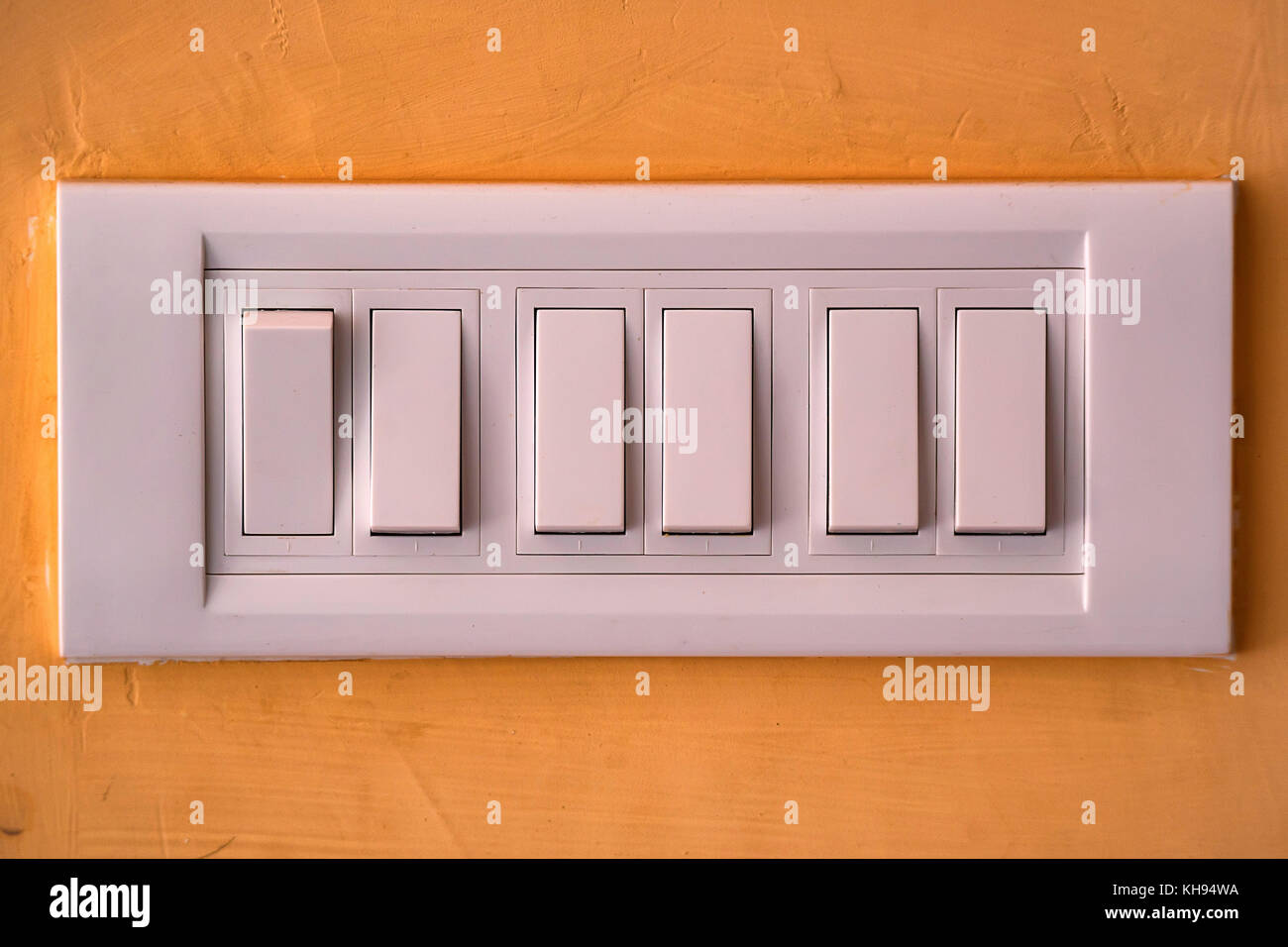 Beige rocker light switch with six buttons Stock Photo - Alamy