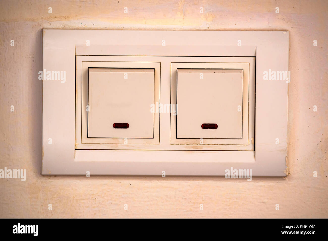 Beige rocker light switch with two buttons Stock Photo - Alamy