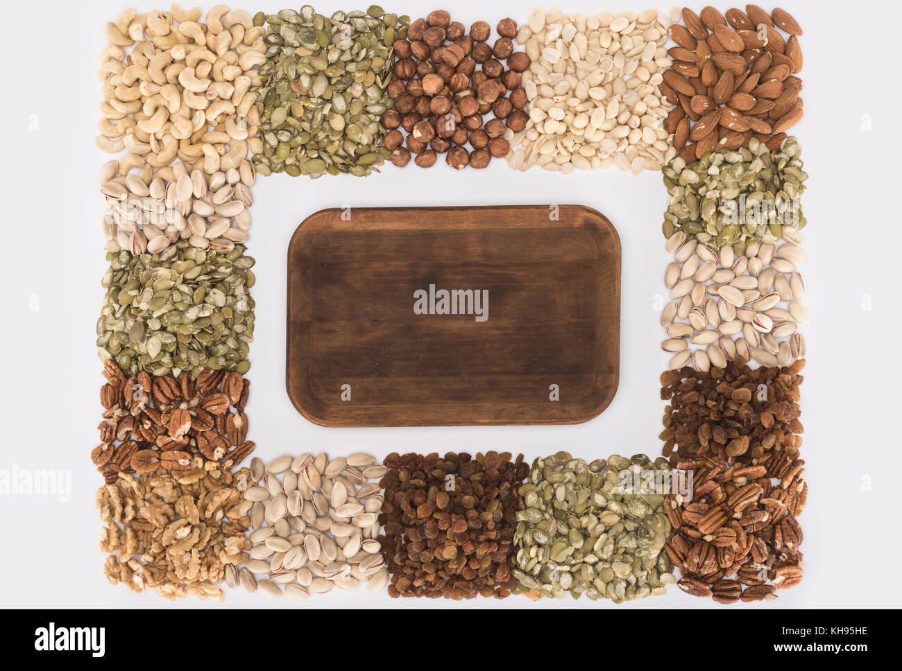 assorted nuts and wooden board Stock Photo - Alamy