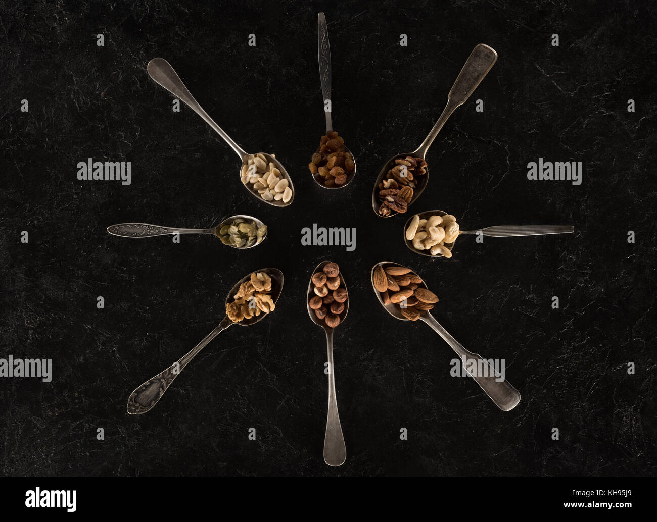 assorted nuts in spoons Stock Photo - Alamy
