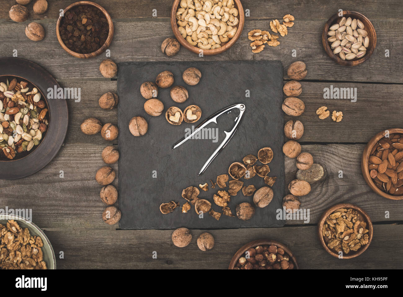 various nuts on wooden table top Stock Photo - Alamy