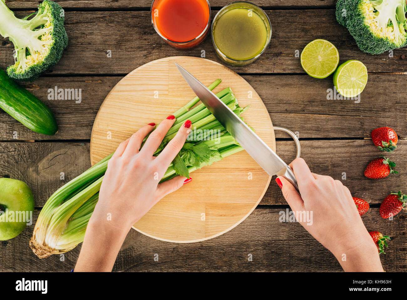 woman cutting celery Stock Photo - Alamy