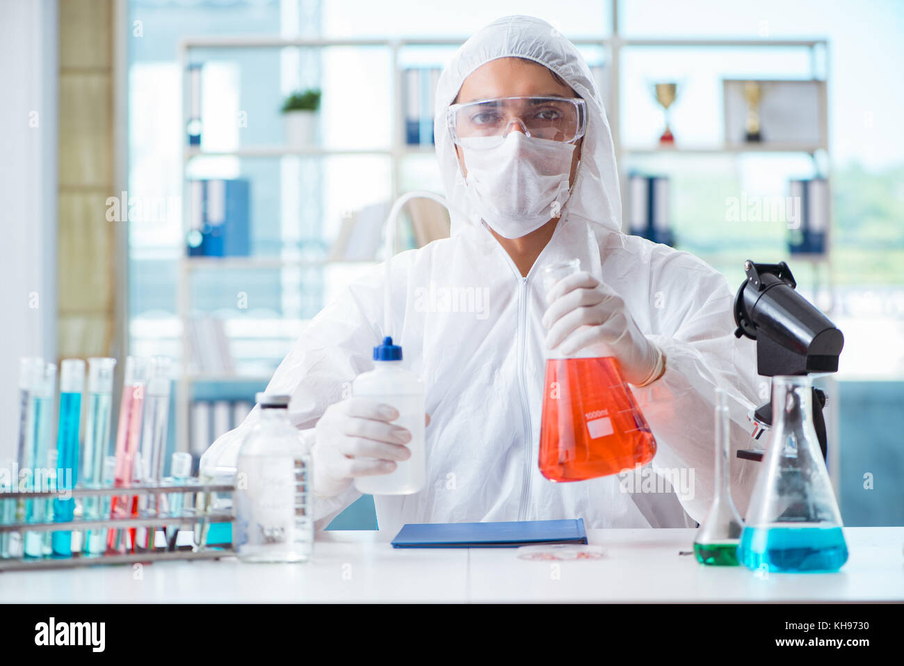 Chemist working in the laboratory with hazardous chemicals Stock Photo ...