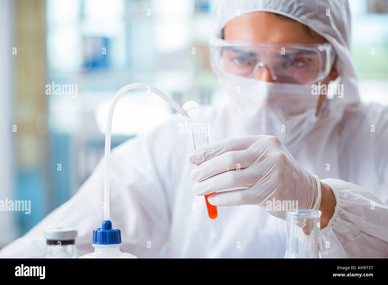 Chemist working in the laboratory with hazardous chemicals Stock Photo ...