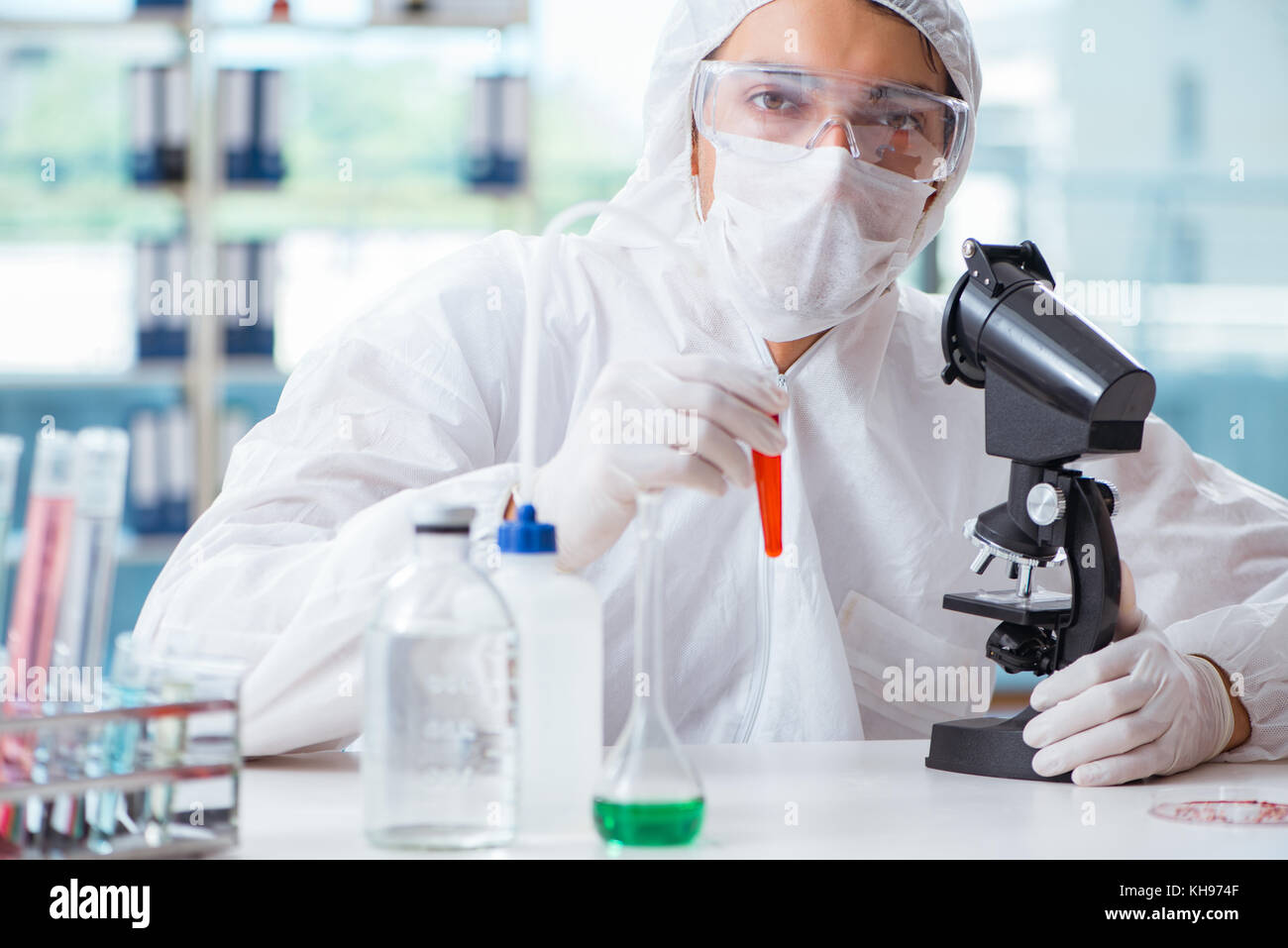 Chemist working in the laboratory with hazardous chemicals Stock Photo ...