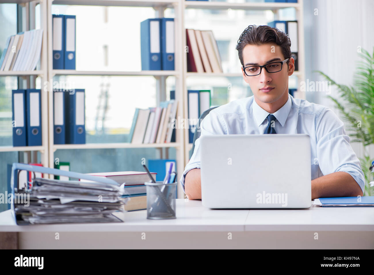 Businessman excessive work paperwork hi-res stock photography and ...