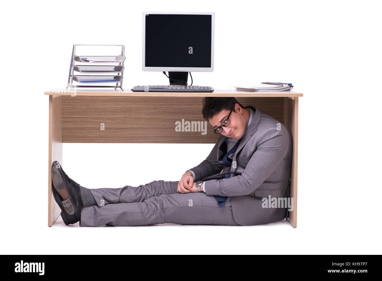 Businessman hiding in the ofice Stock Photo - Alamy