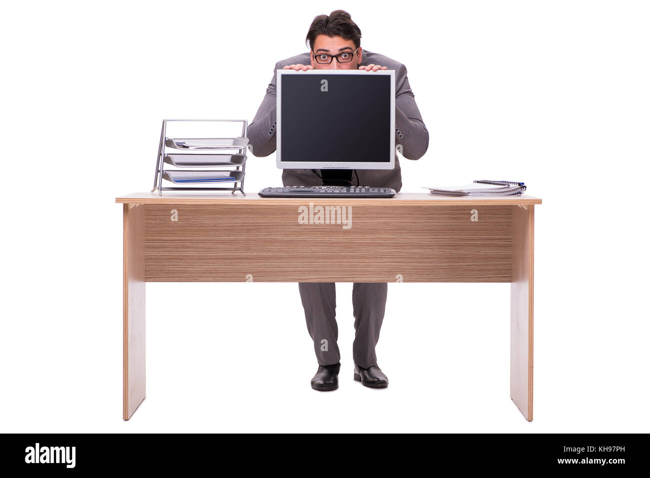 Businessman hiding in the office isolated on white Stock Photo - Alamy