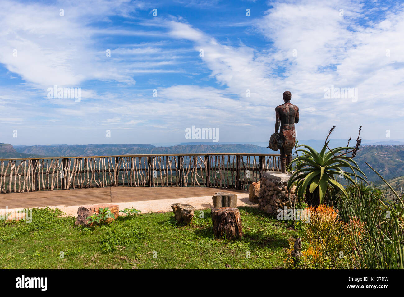 Zulu metal statue rear overlooking viewpoint tribal homes over thousand ...