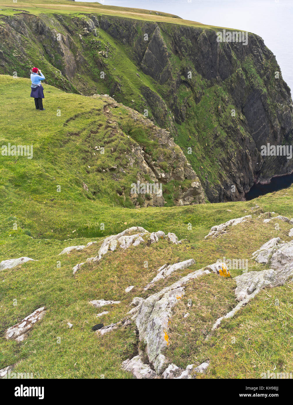dh Cliffs WEST COAST FAIR ISLE Birdwatcher binoculars watching for ...