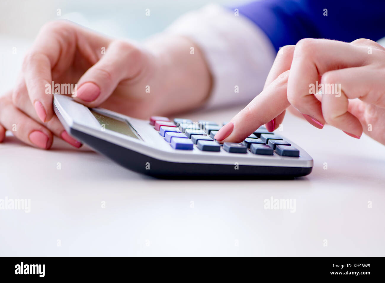 Hands working on accounting calculator calculating profit Stock Photo ...