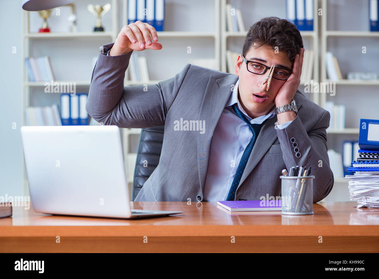 Businessman sweating excessively smelling bad in office at workplace ...