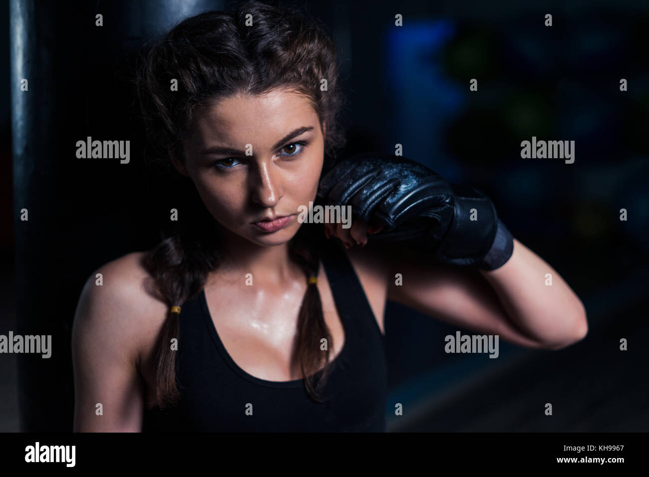 Young fighter boxer girl wearing boxing gloves during training w Stock ...