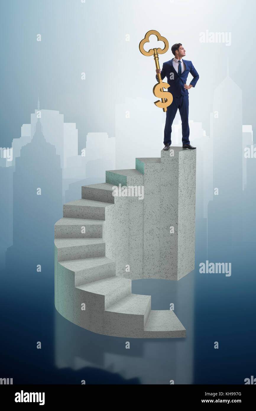 Businessman with key to success at the top of career Stock Photo - Alamy