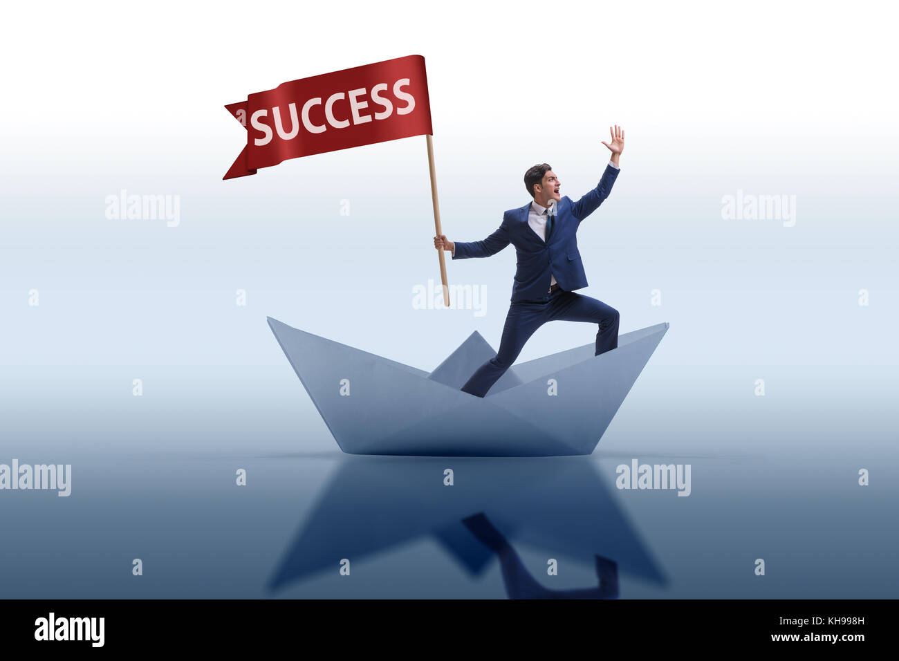 Businessman riding paper boat ship in success concept Stock Photo - Alamy
