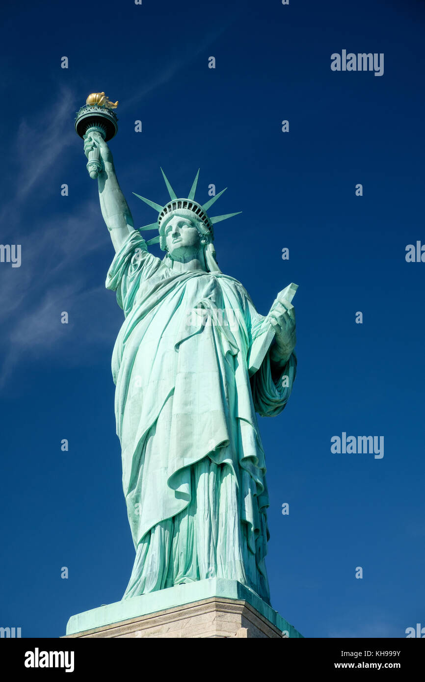 Statue of Liberty close up against a blue sky, also known as Lady ...
