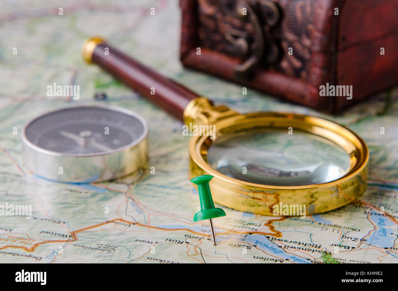 Travel concept with compass and map Stock Photo - Alamy