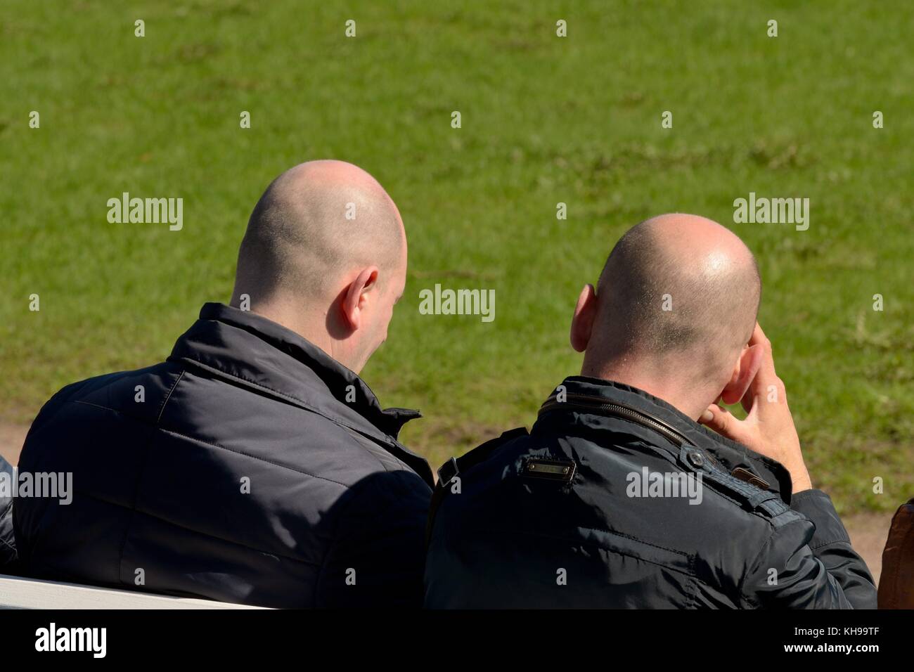 Russia.Saint-Petersburg.23.05.2016.Warm summer day two men sit on a ...